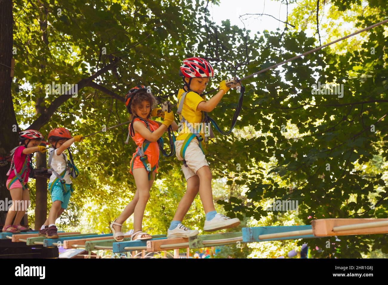 The kids are climbing on the suspension bridge Stock Photo - Alamy
