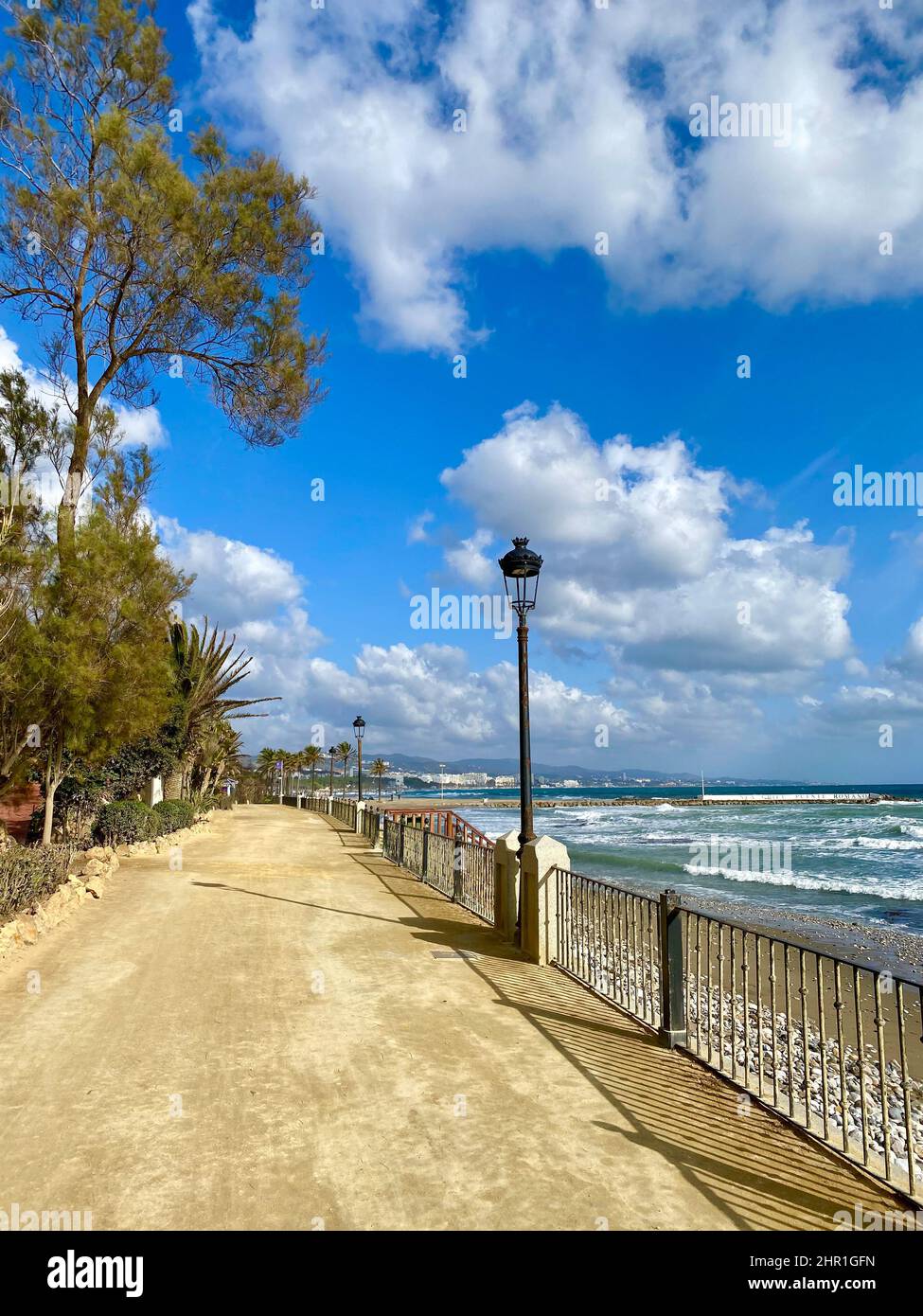 beautiful Marbella promenade landscape with blue sky and white clouds ...