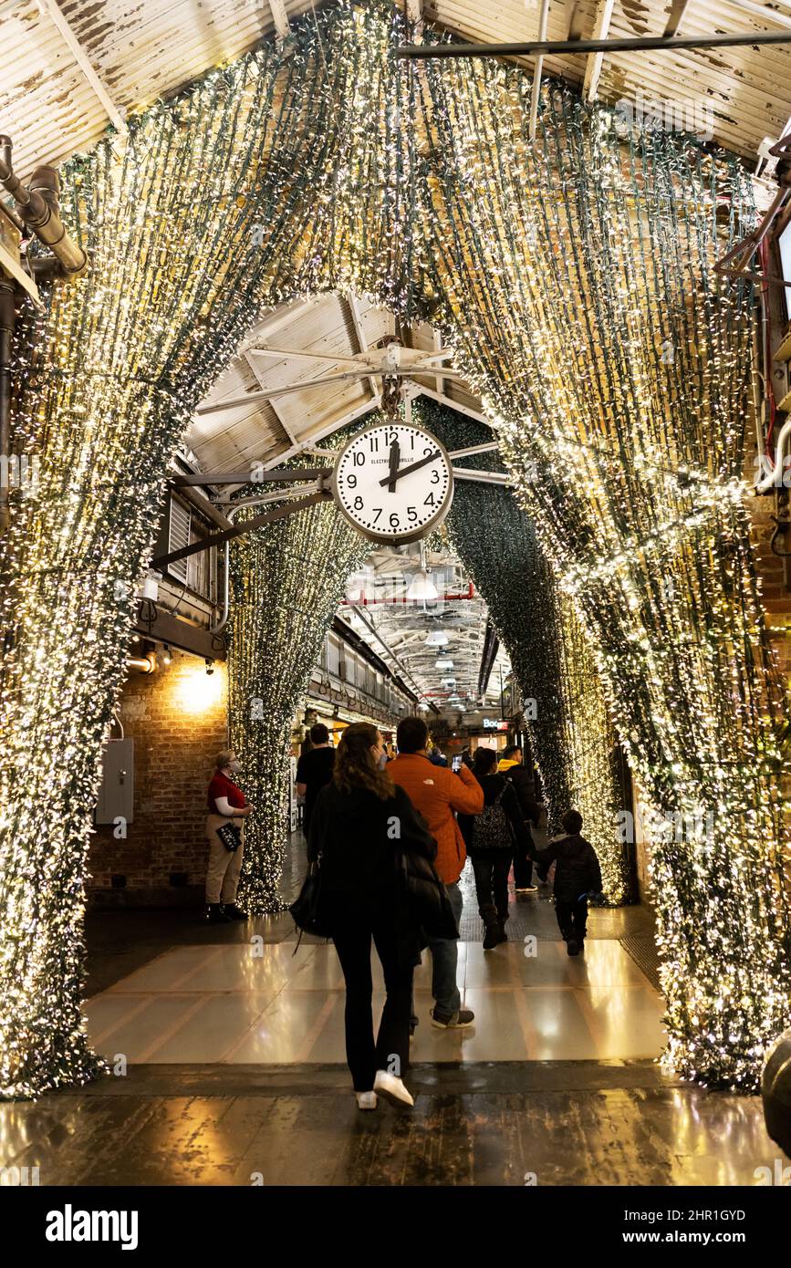 Lights decorate a busy hallway at Chelsea Market in the Meatpacking ...