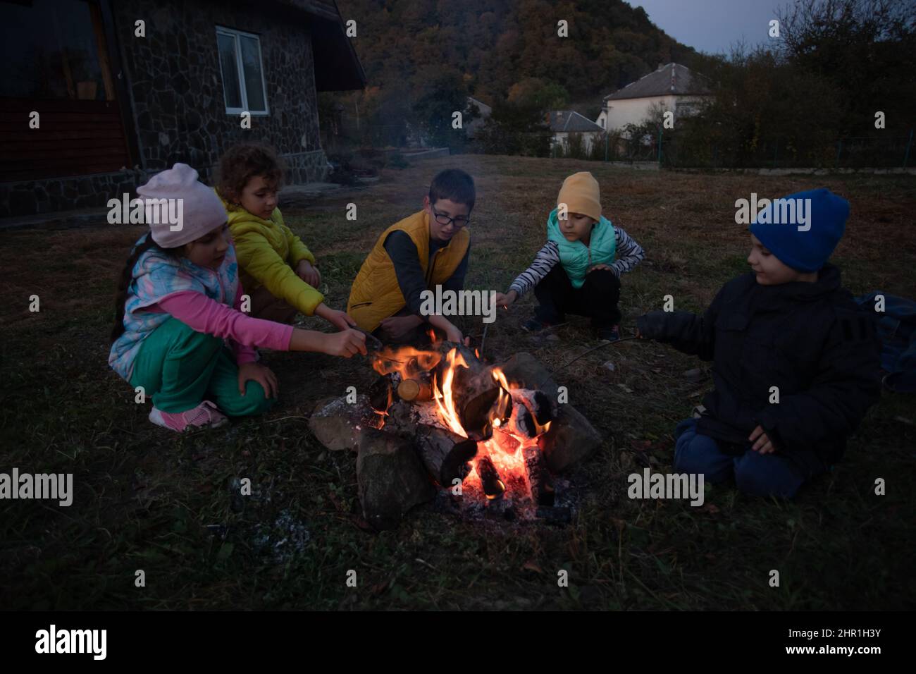 Children in the camp by the fire Stock Photo - Alamy