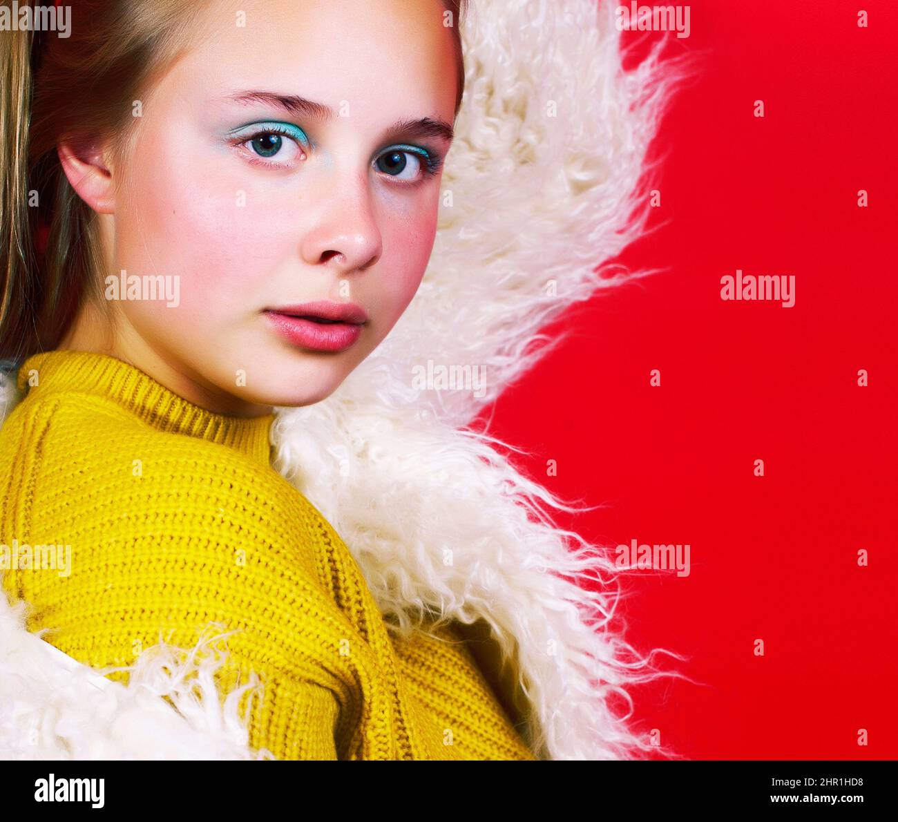 young pretty emitonal posing teenage girl on bright red background ...