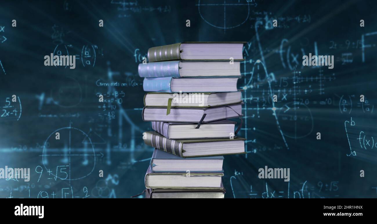 Pile of books and mathematical equations and graphs Stock Photo - Alamy