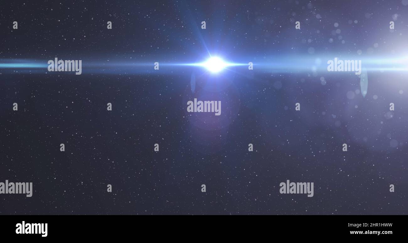 Image of glowing blue light moving over spots of light on purple ...