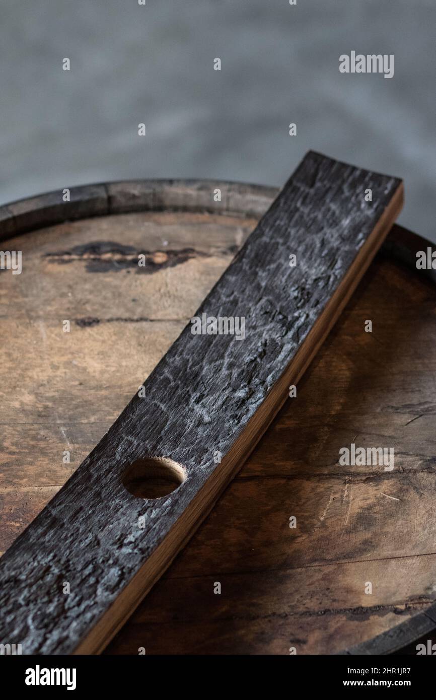 whiskey barrel stave laying across bourbon barrel Stock Photo - Alamy