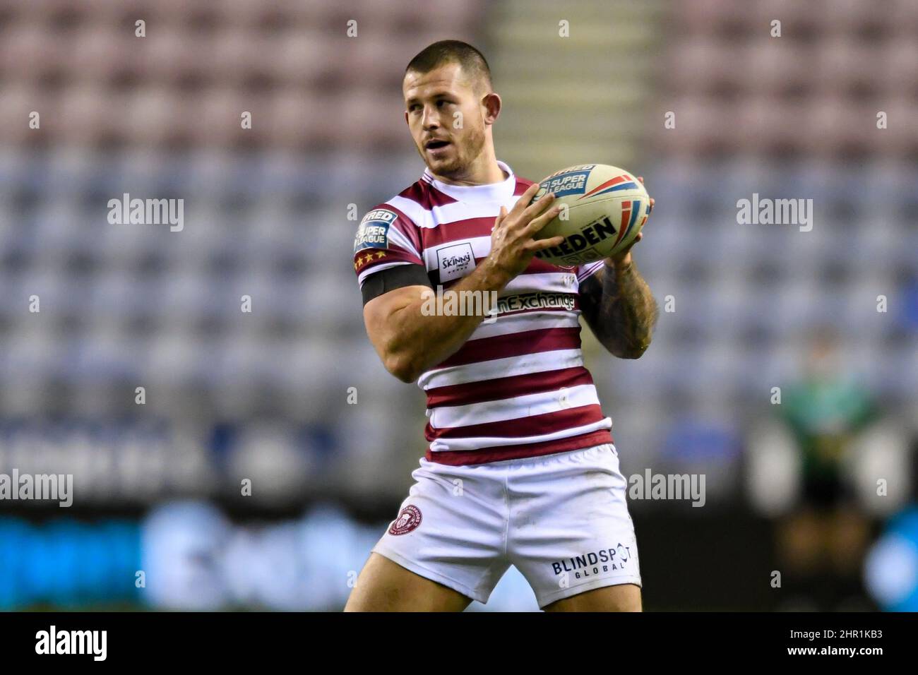 Cade Cust #6 of Wigan Warriors with the ball Stock Photo - Alamy