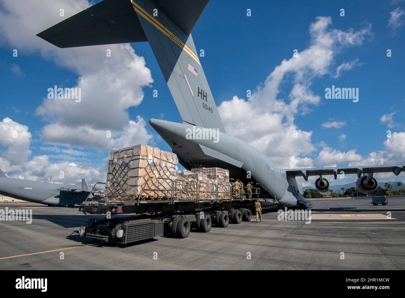 A C-17 from the Hawaii Air National Guard sits on the flight line while ...