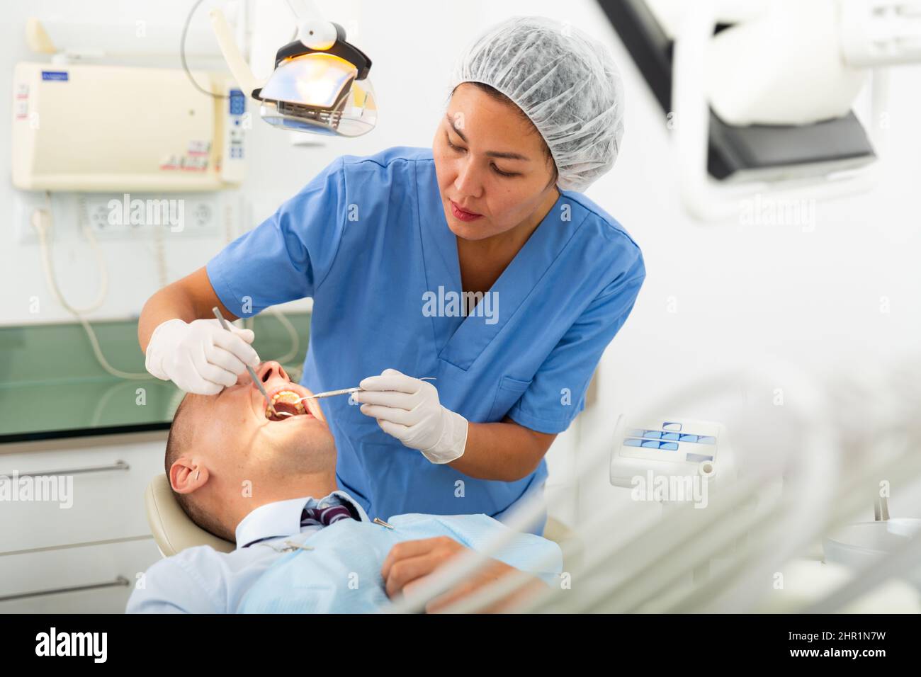 Visit dentist man treats teeth hi-res stock photography and images - Alamy