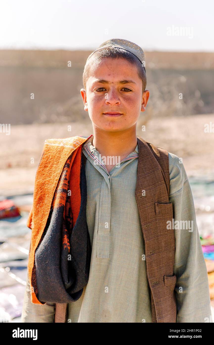 A young boy at an Afghan market in Tarin Kot, Afghanistan Stock Photo ...
