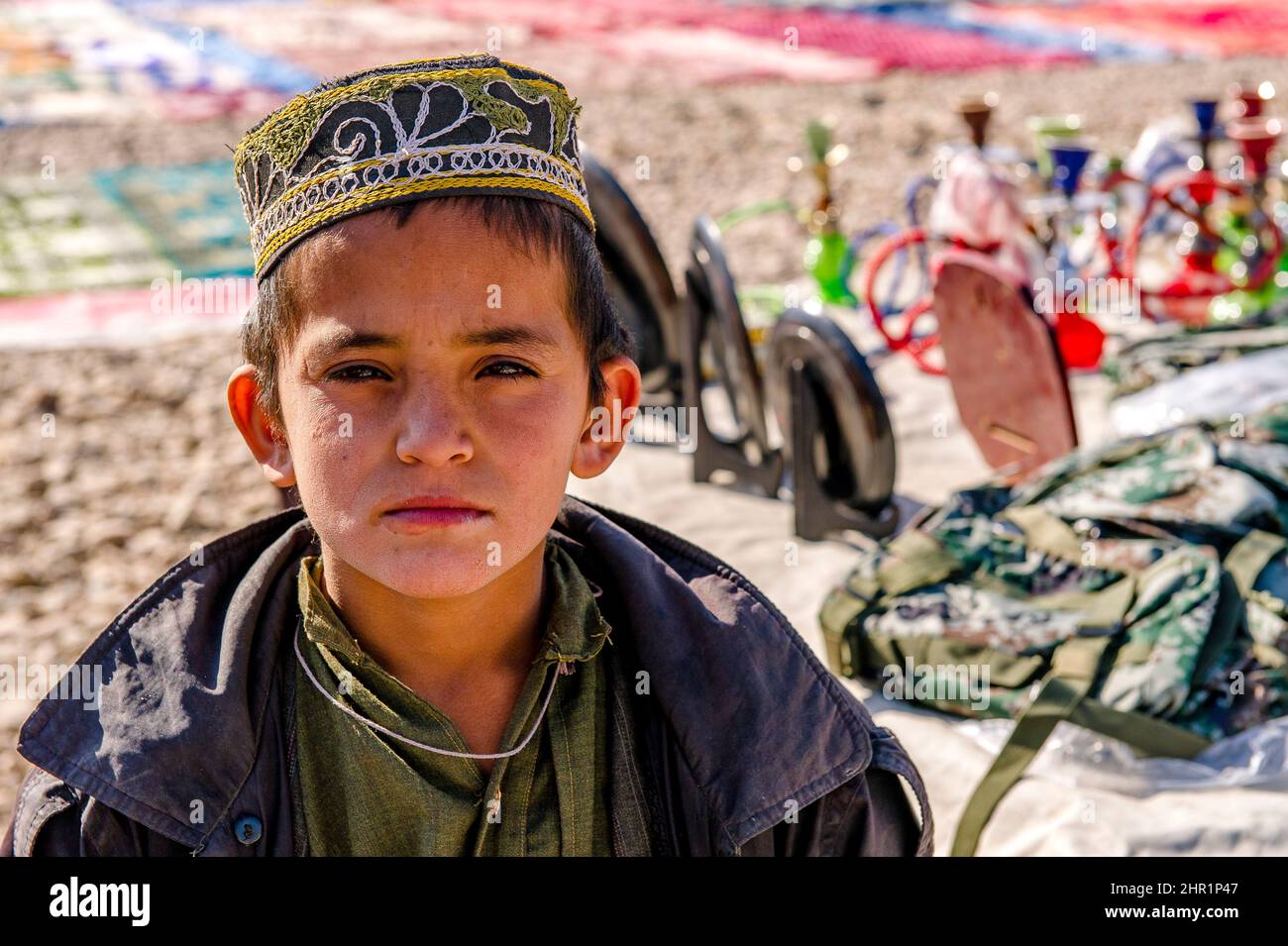A young boy at an Afghan market in Tarin Kot, Afghanistan Stock Photo ...