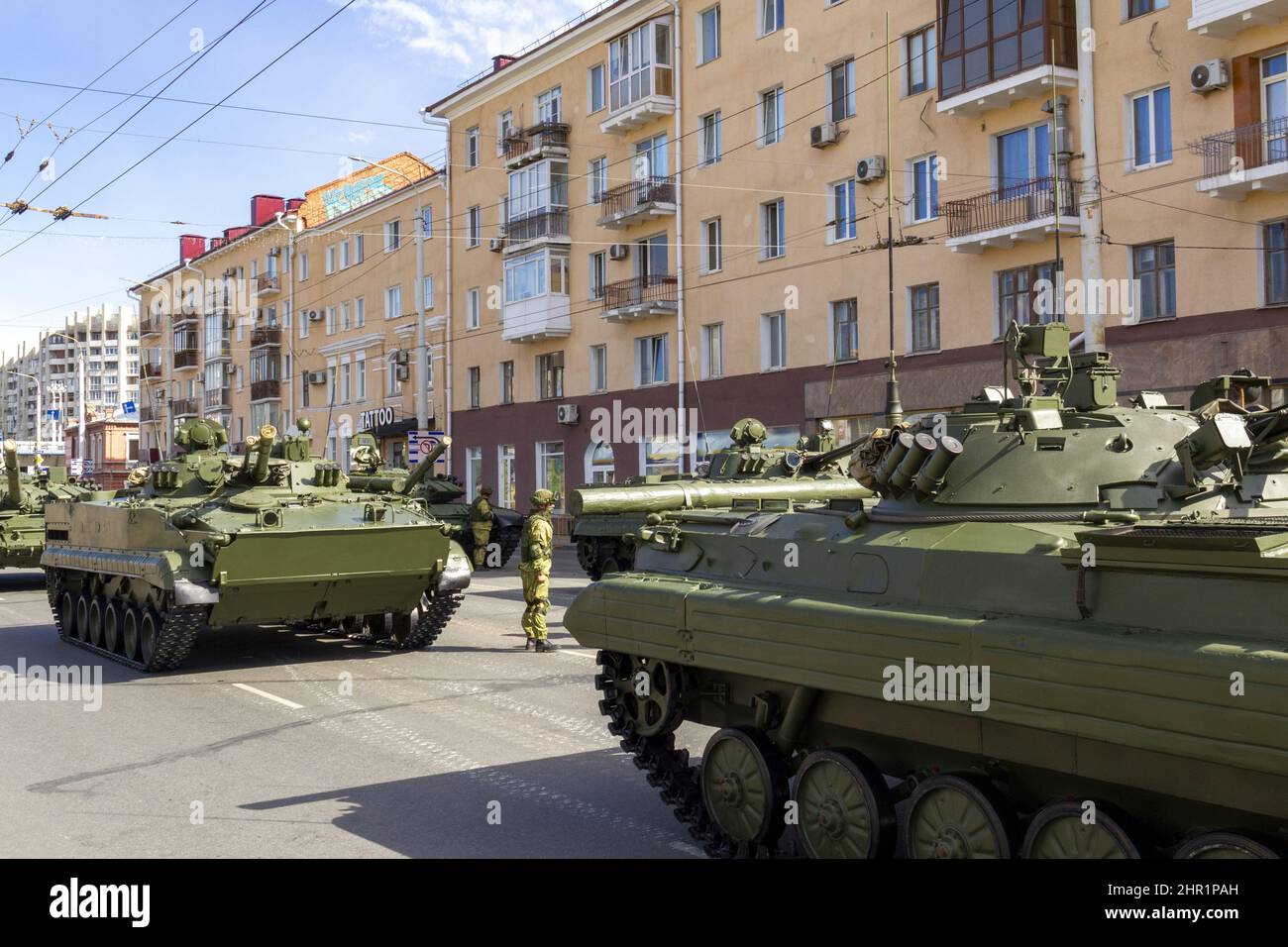 Military vehicles and equipment on the street of city. The concept of ...
