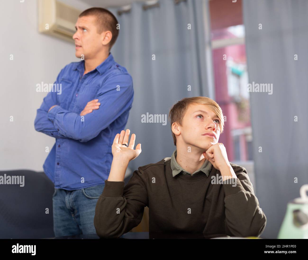 Portrait of angry father quarreling with teenage son Stock Photo - Alamy