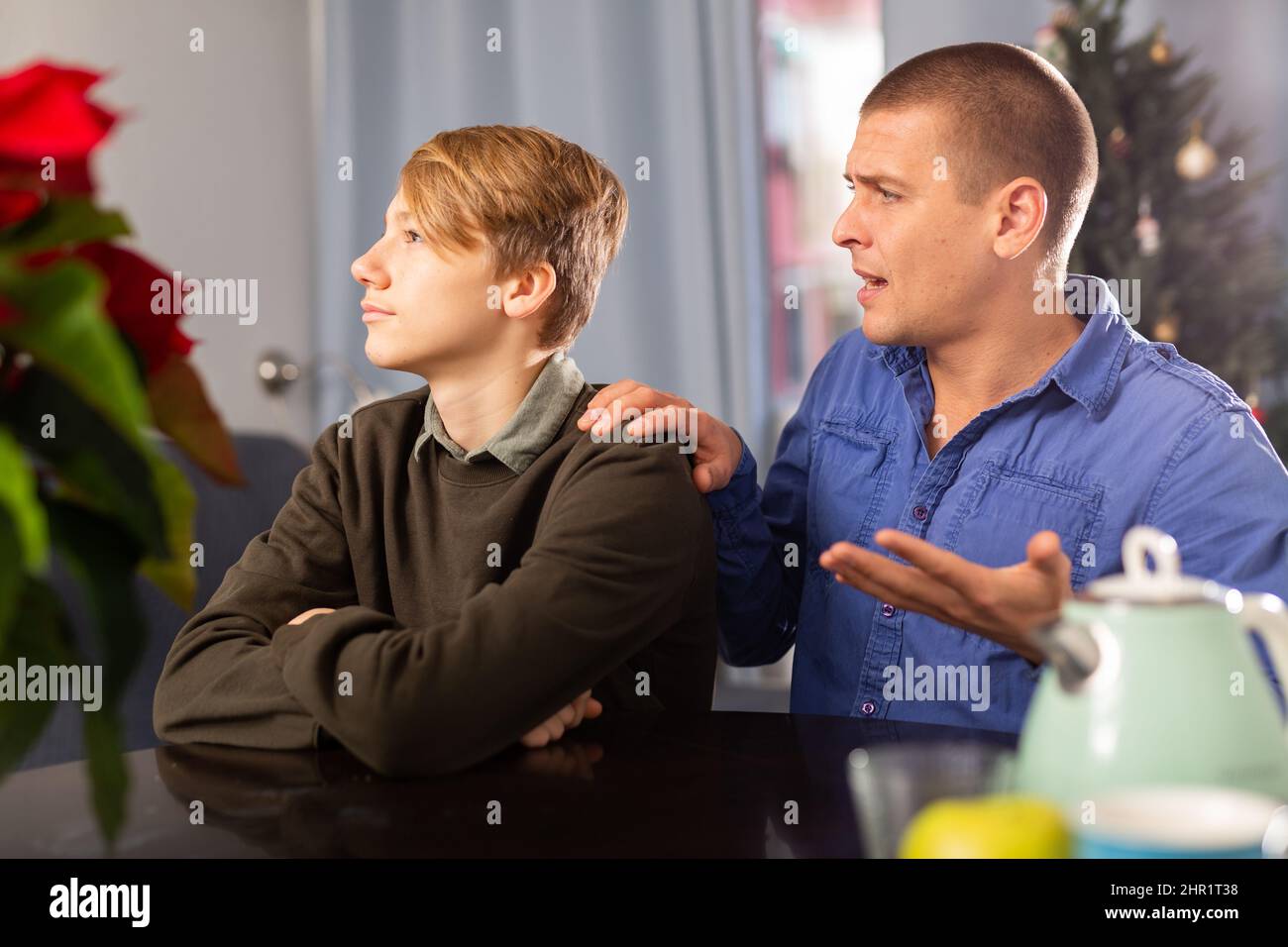 Man scolding his son before Xmas Stock Photo - Alamy