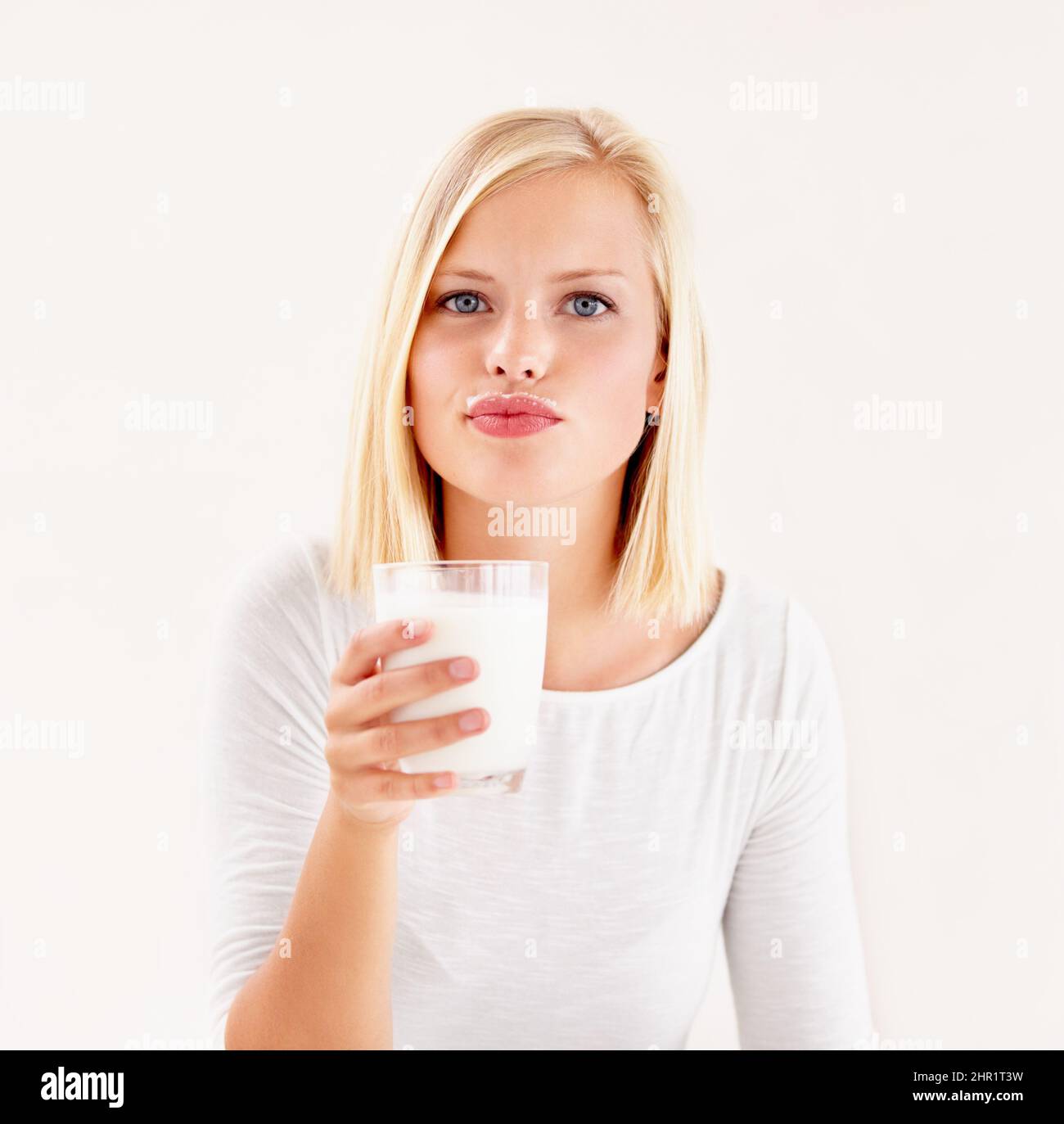 Get refreshed. Shot of a young woman enjoying a drink Stock Photo - Alamy
