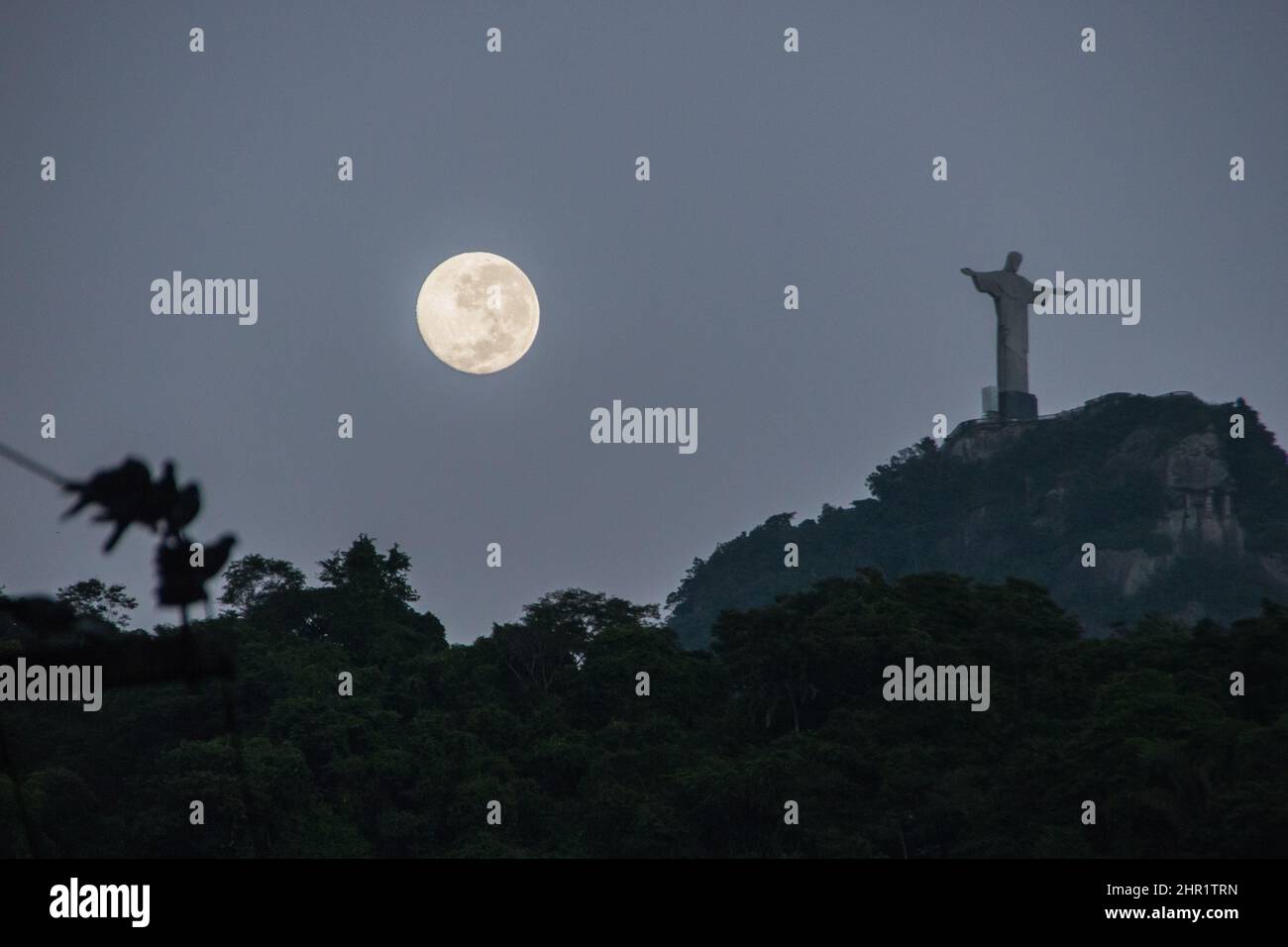 Full moon with Christ the Redeemer in Rio de Janeiro, Brazil - January ...
