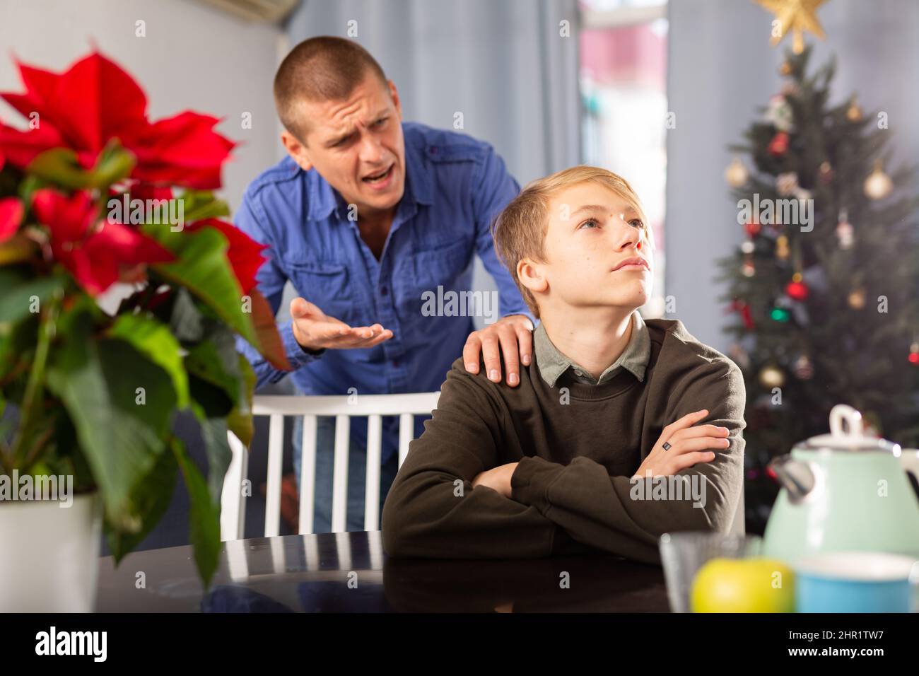 Father and son quarrel while celebrating christmas in home Stock Photo ...