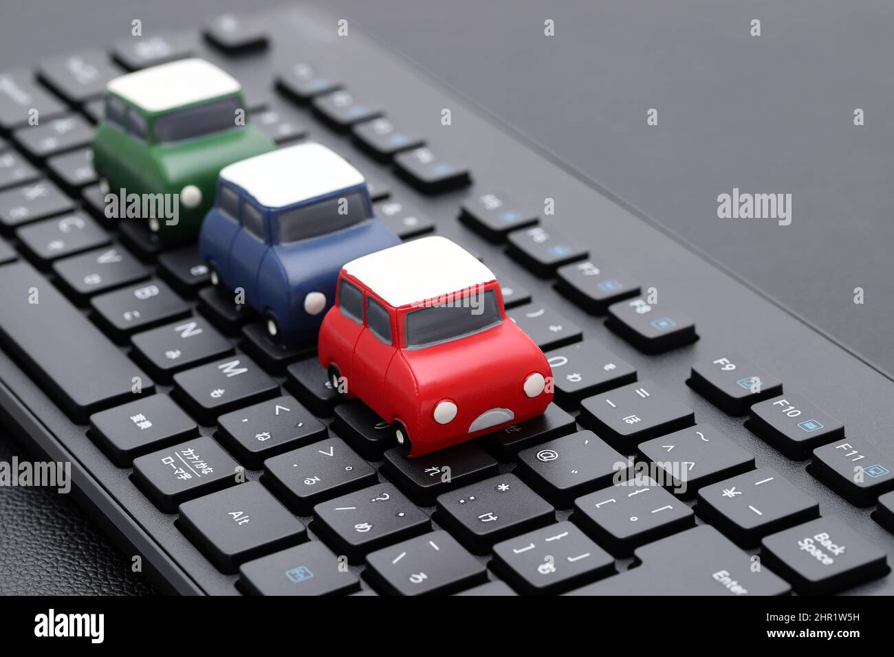 Small toy car on Alphabetics and Japanese hiragana typing keyboard ...