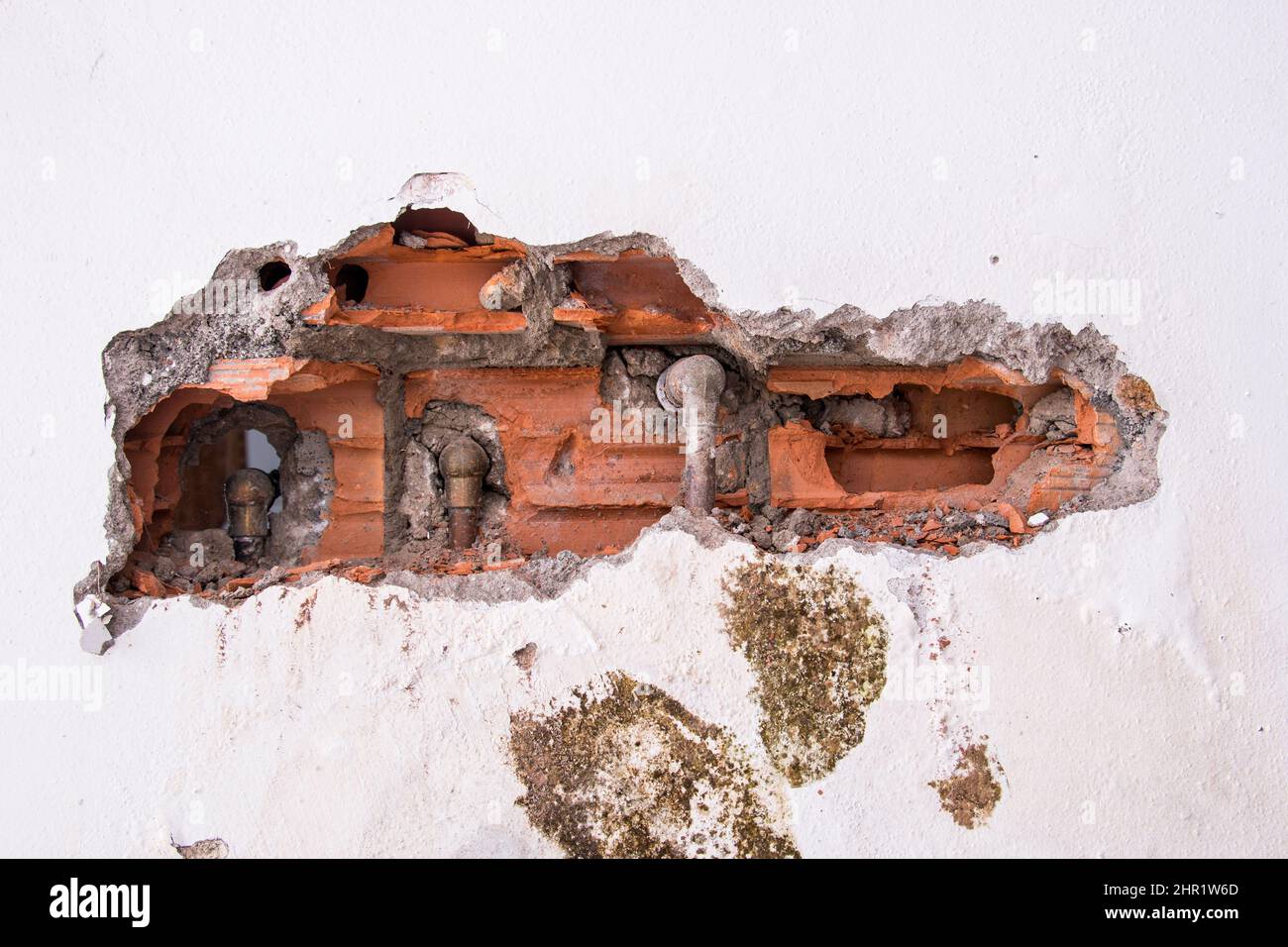broken white wall with exposed bricks in a building in Rio de Janeiro ...
