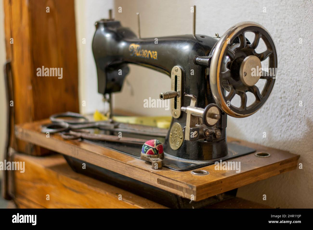 Old vintage sewing machine with an old rusty pair of scissors and a ...