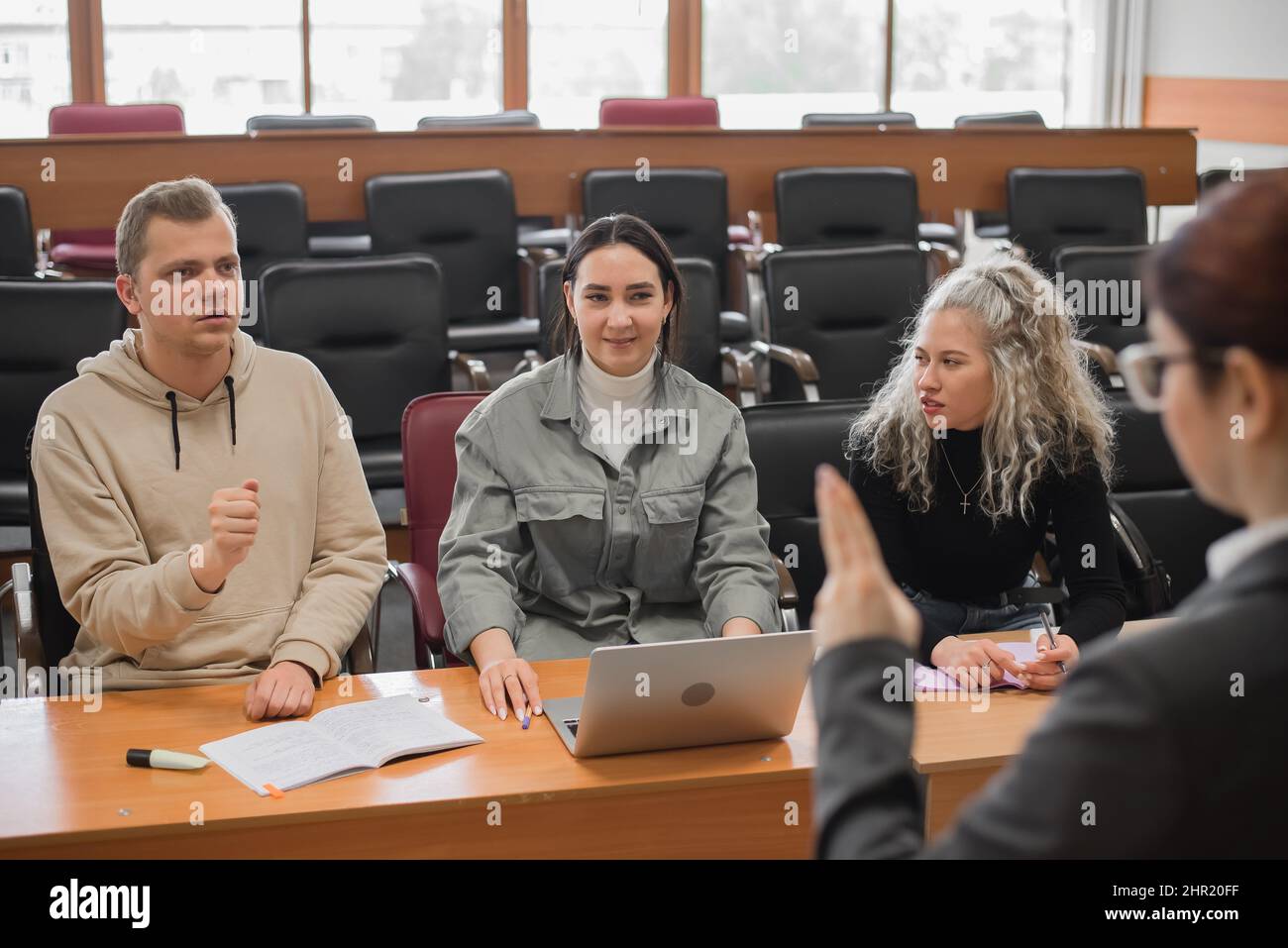 The teacher and students communicate in sign language in the classroom ...