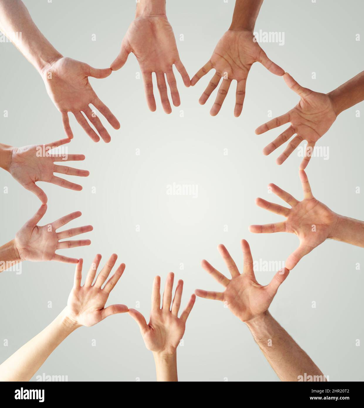 All for one and one for all. Low angle shot of hands in a circle ...