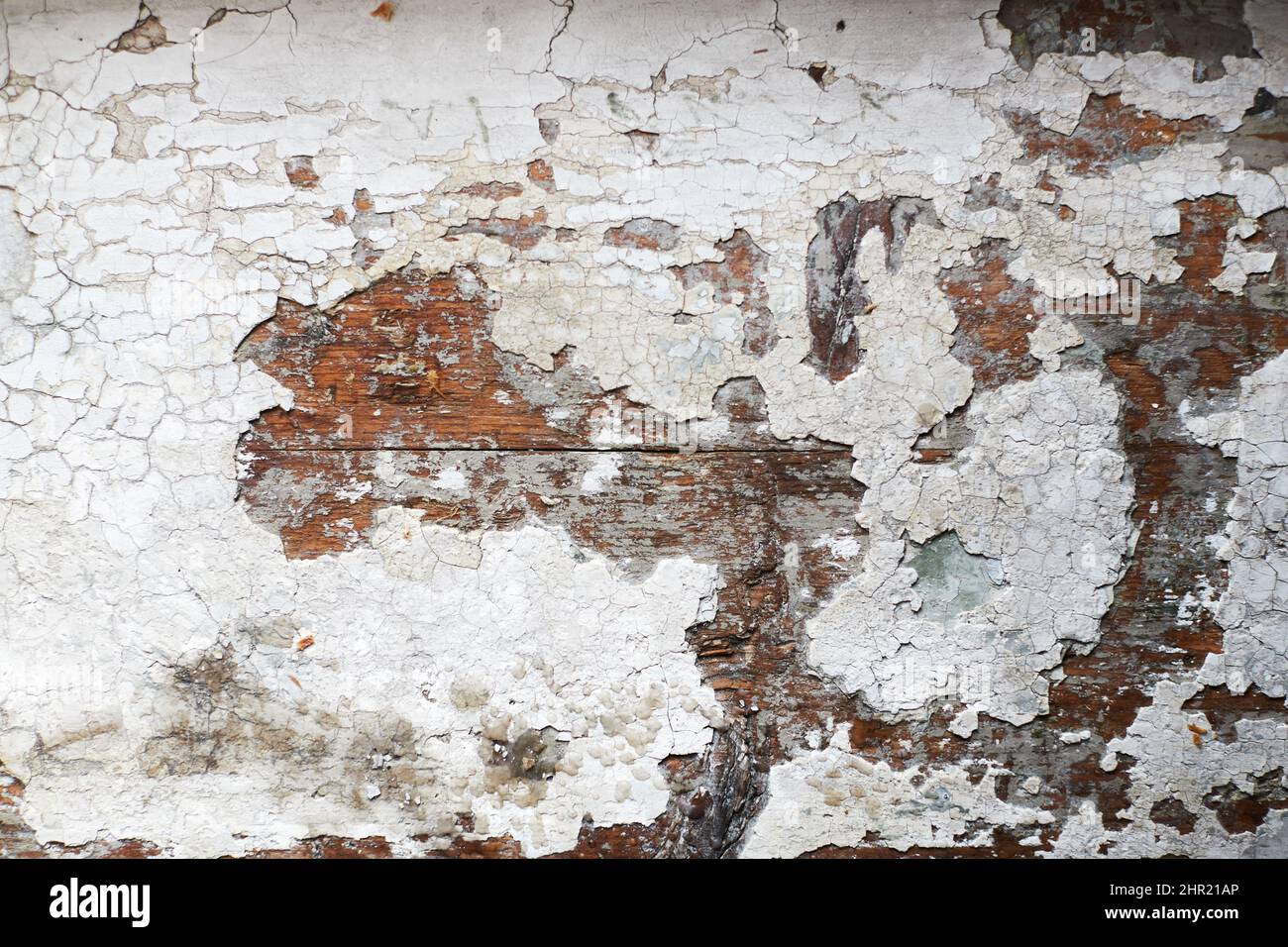 The texture of the wooden desk with swollen and peeling paint. Front ...