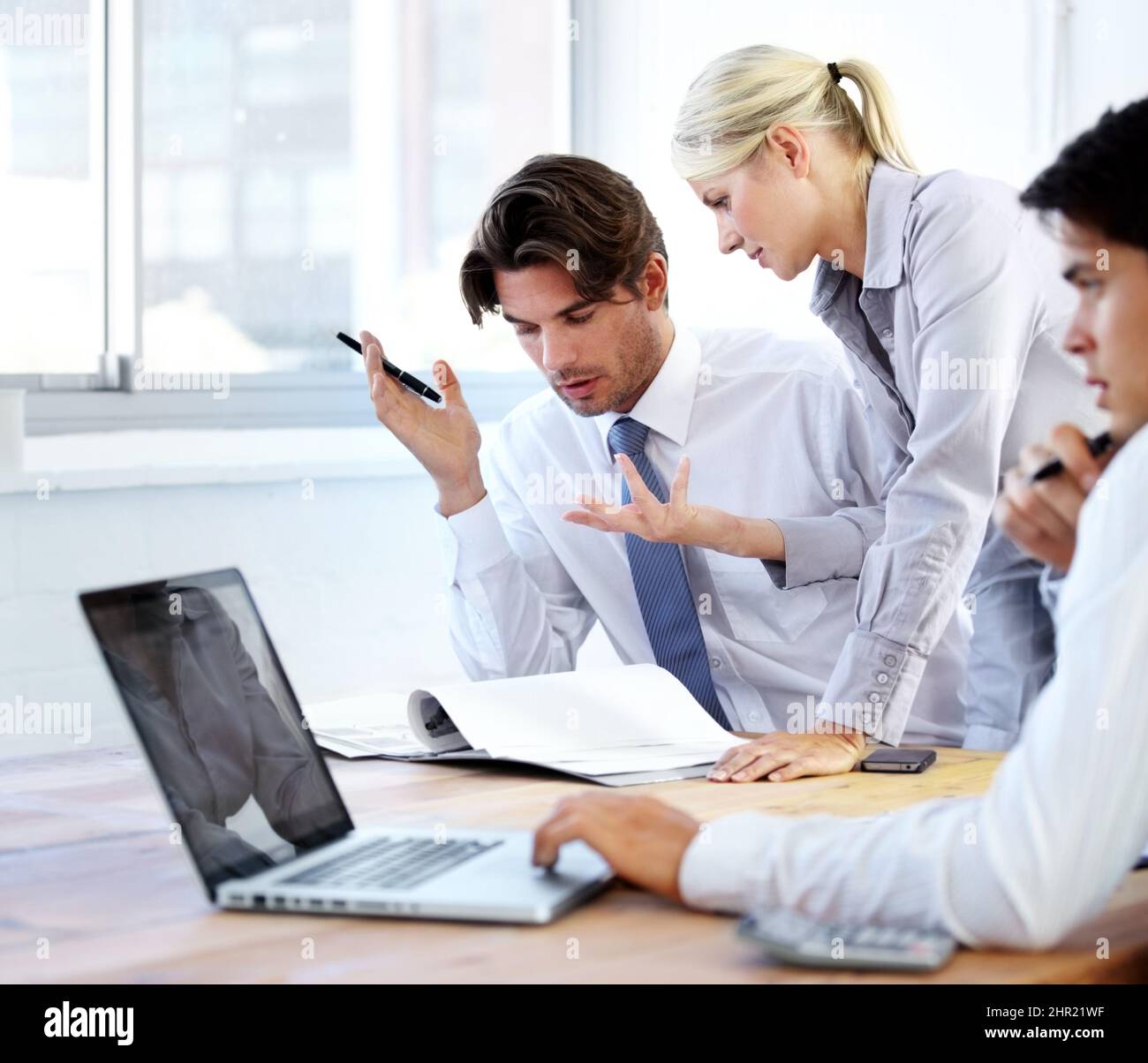 Together we get work done. Group of businesspeople working together as ...
