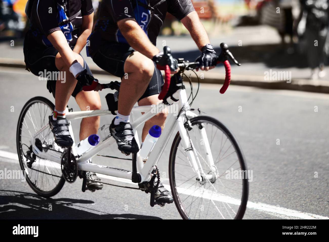 Two sets of legs are better than one. A cropped shot of two people ...