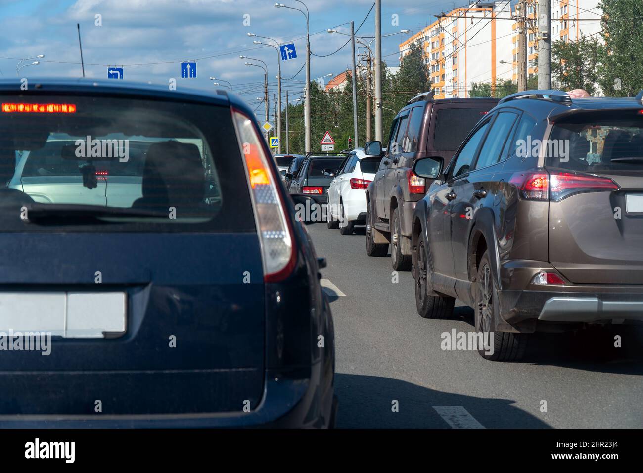 Cars standing in a traffic jam on a city street Stock Photo - Alamy