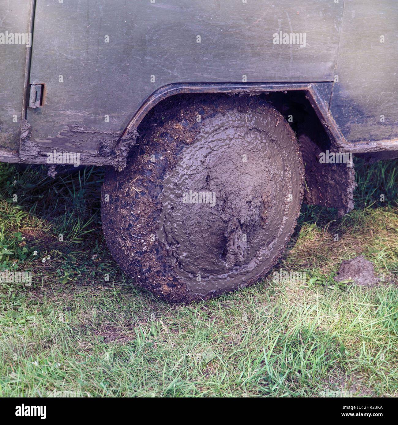 Dirty wheel of an old SUV in sticky mud Stock Photo - Alamy
