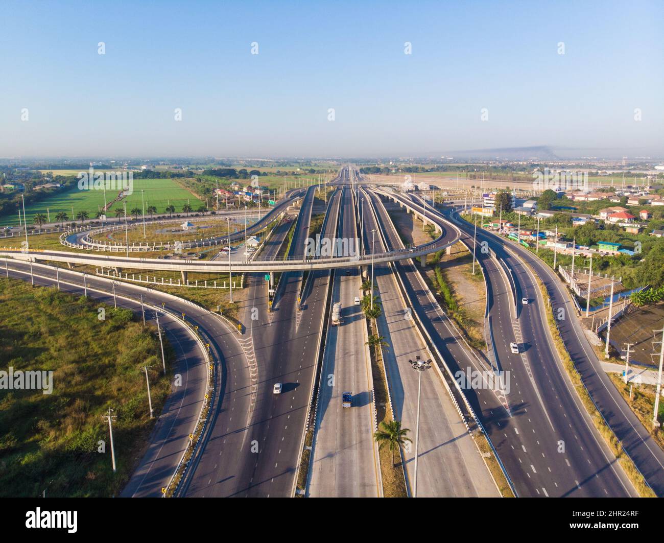 Transport junction freeway road with vehicle movement in morning rural ...