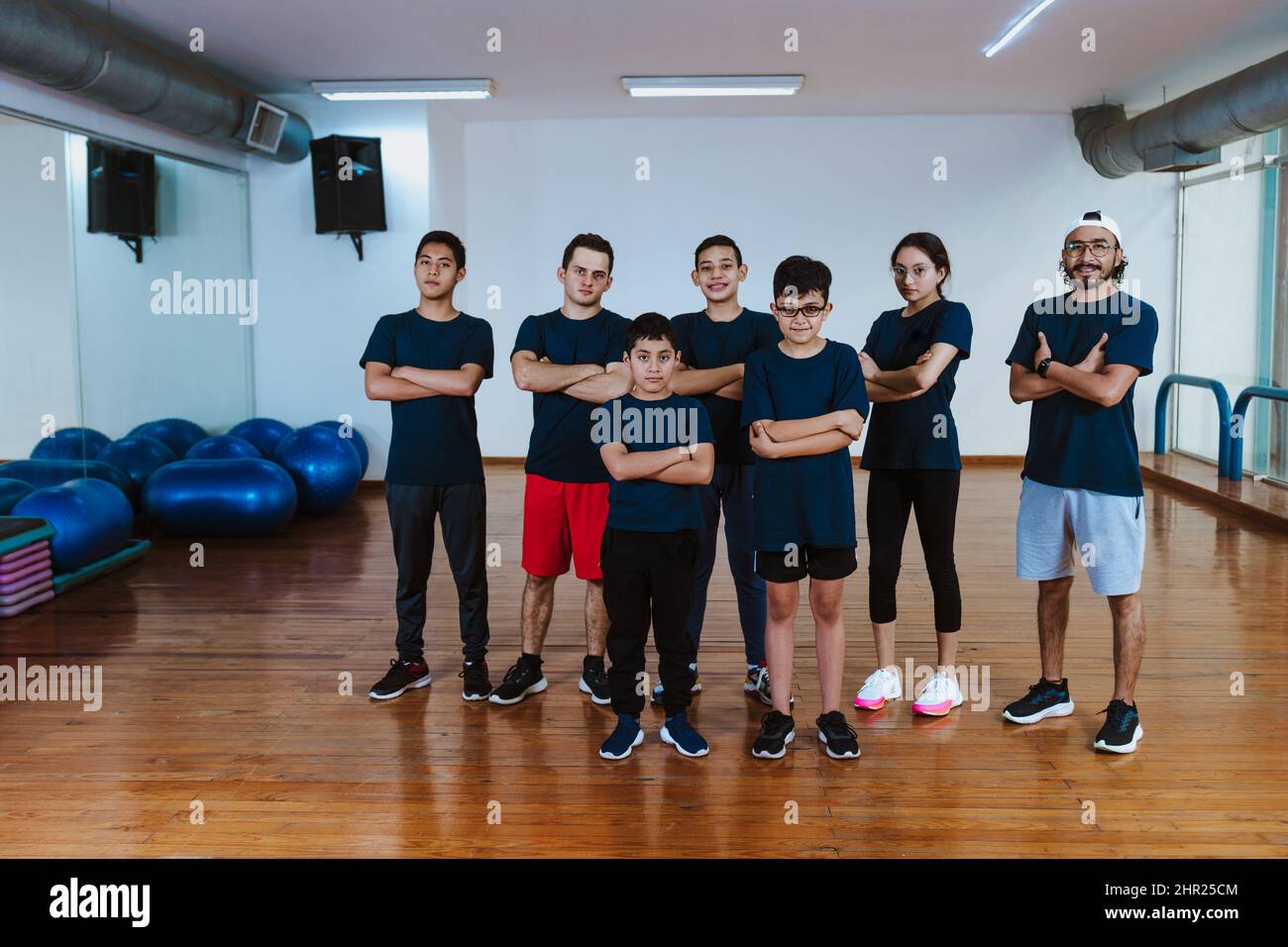 Latin teenagers and hispanic children with instructor man posing ...