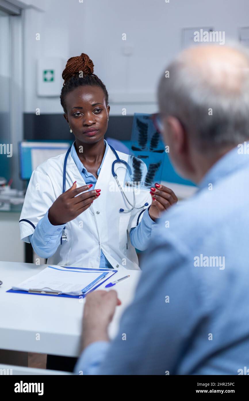 Clinic radiology specialist analyzing x-ray image scan and diagnostic ...