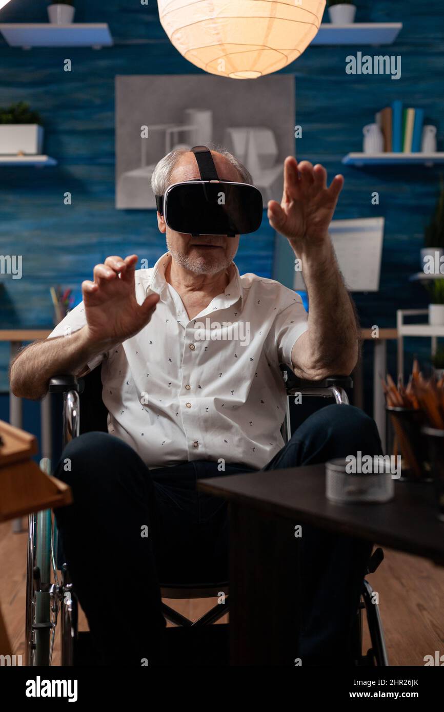 Portrait of retired artist living with disability using virtual reality ...