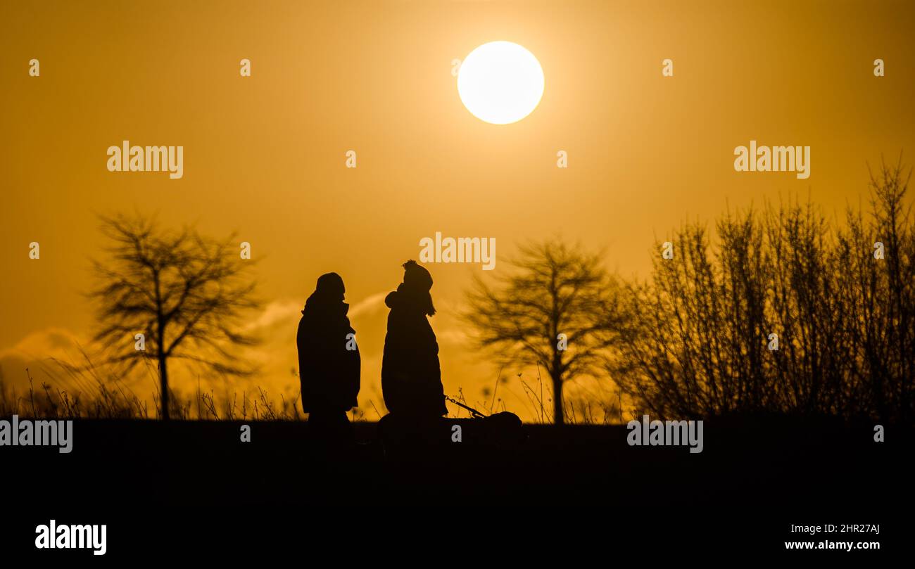 Hanover, Germany. 25th Feb, 2022. Passers-by with dogs walk in the ...