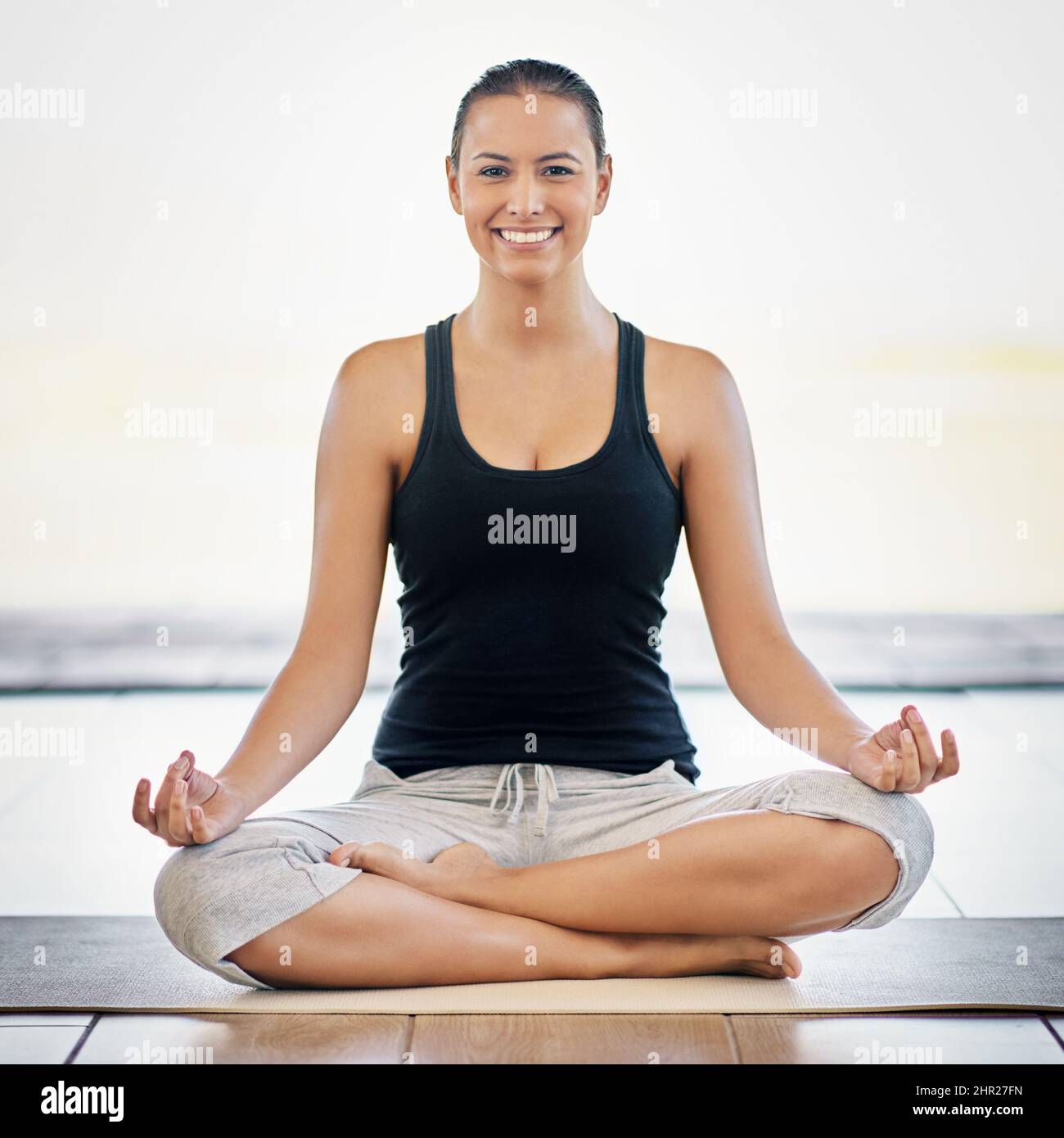Meditating makes me smile. Full length portrait of a young woman ...