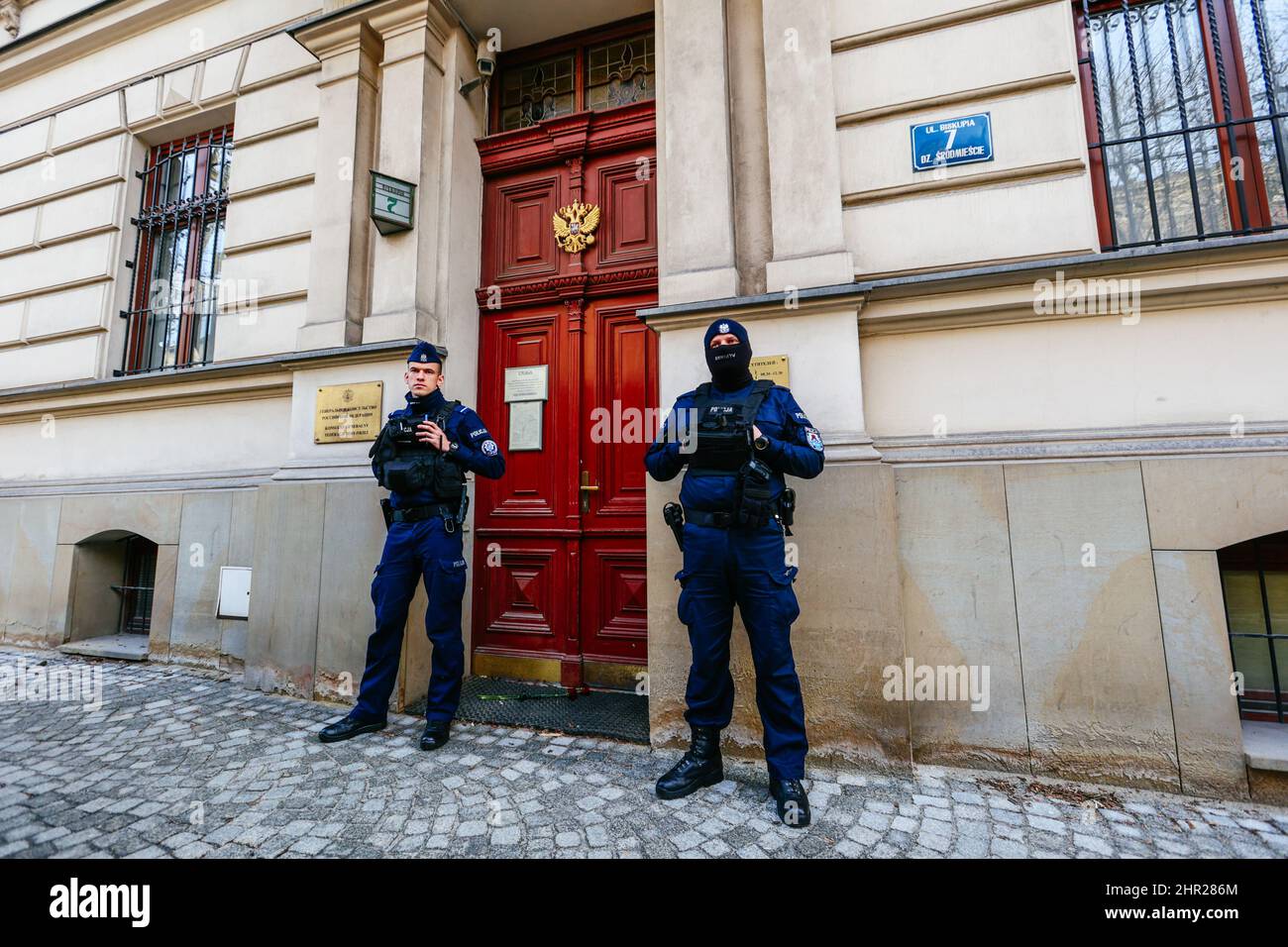 Two Polish police officers stand in front of the Russian Consulate ...
