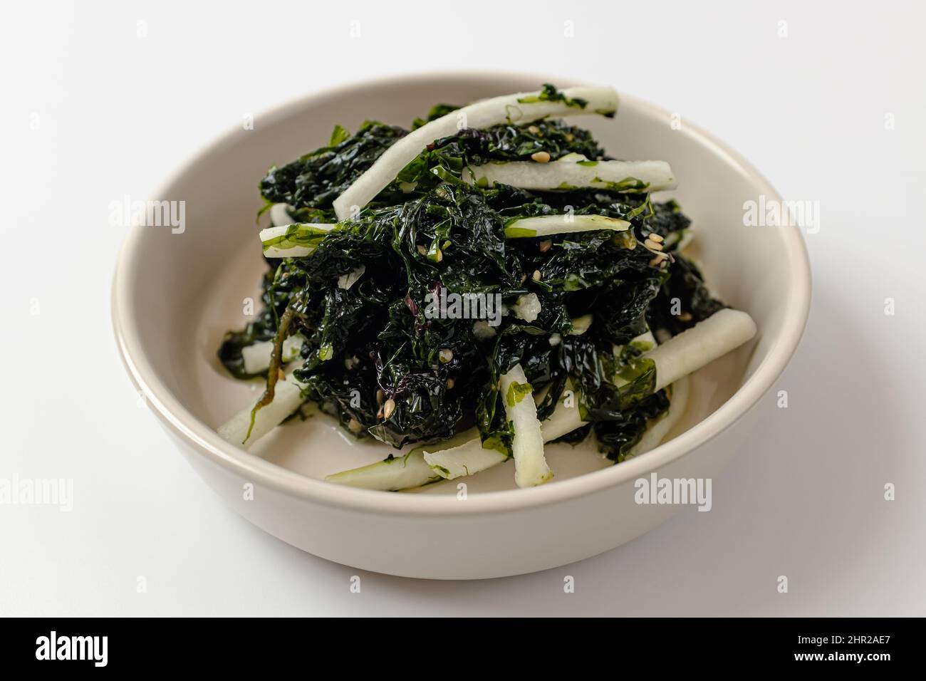 pickled green laver on a white background Stock Photo - Alamy