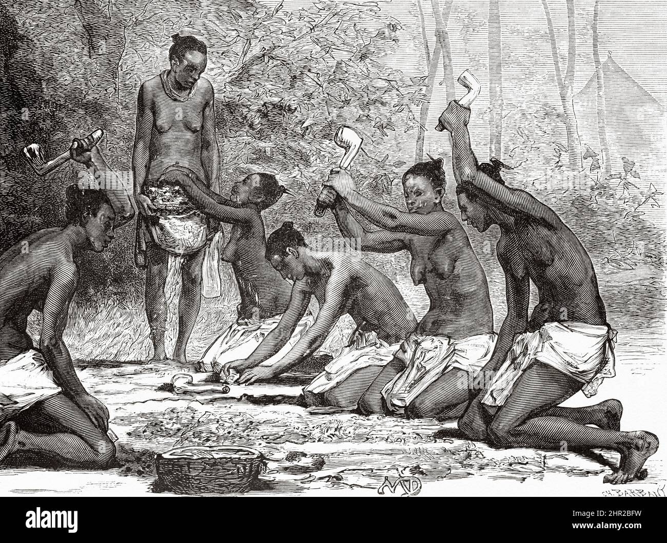 Indigenous women of a tribe grinding grain, Central Africa. Old 19th ...