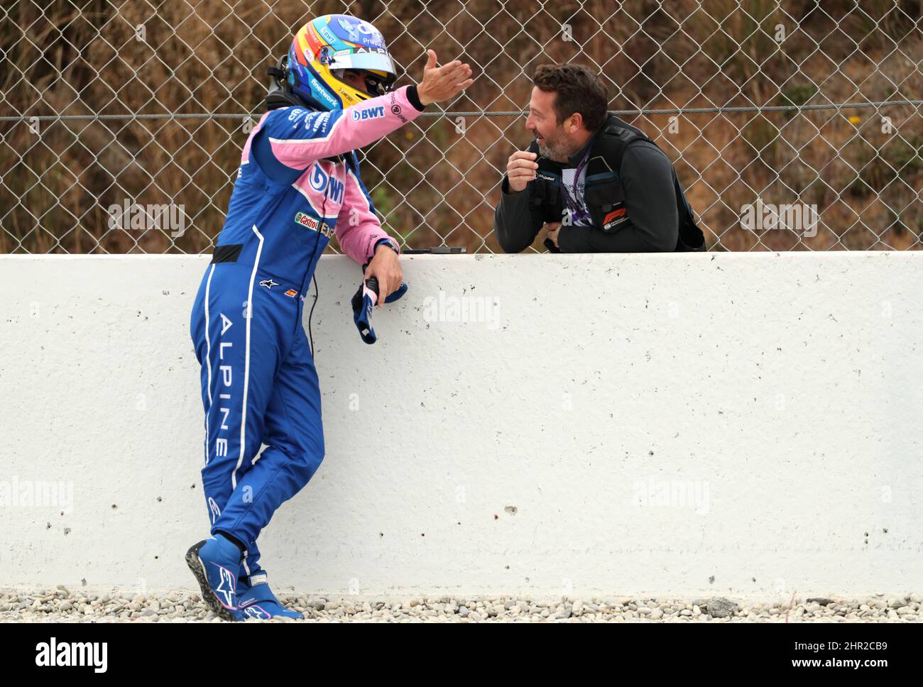 Alpine's Fernando Alonso (left) reacts as his car breaks down during ...