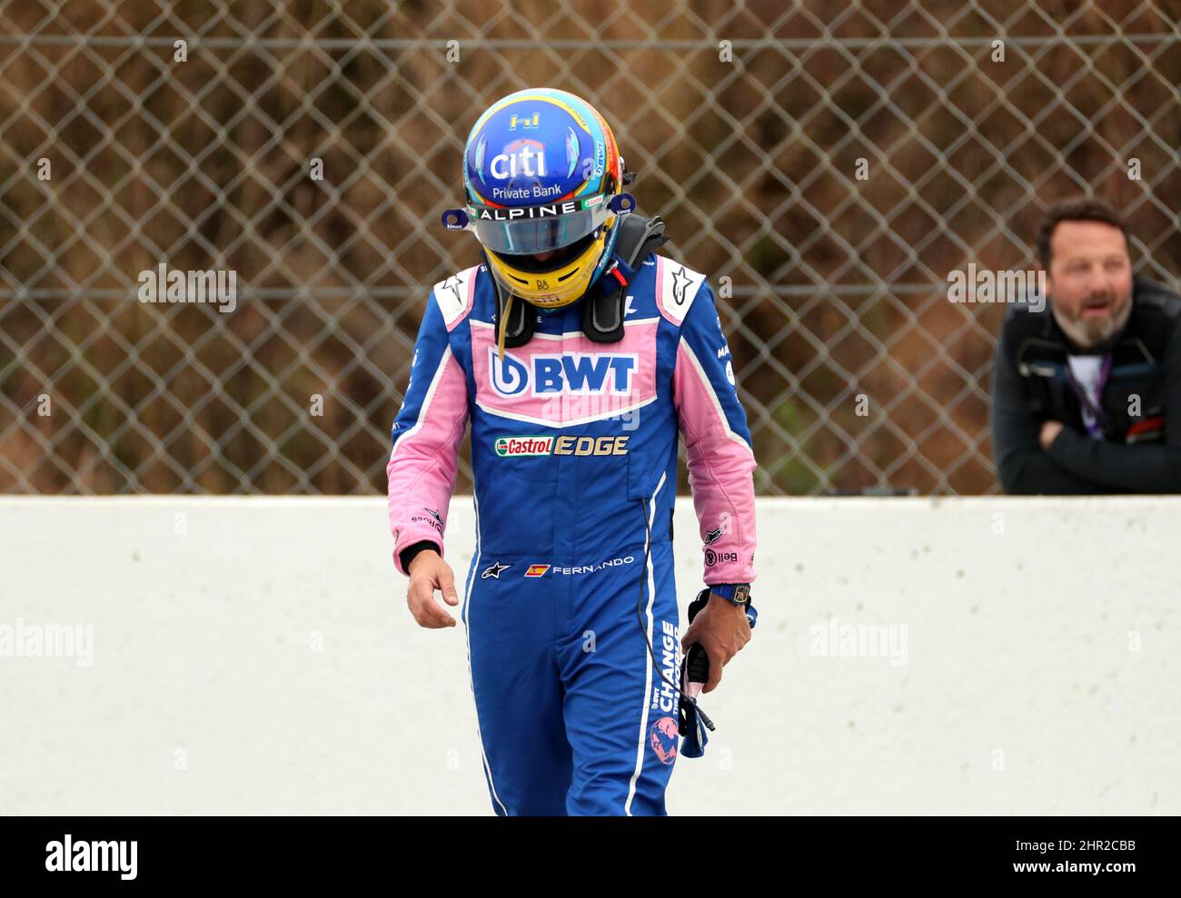 Alpine's Fernando Alonso (left) reacts as his car breaks down during ...