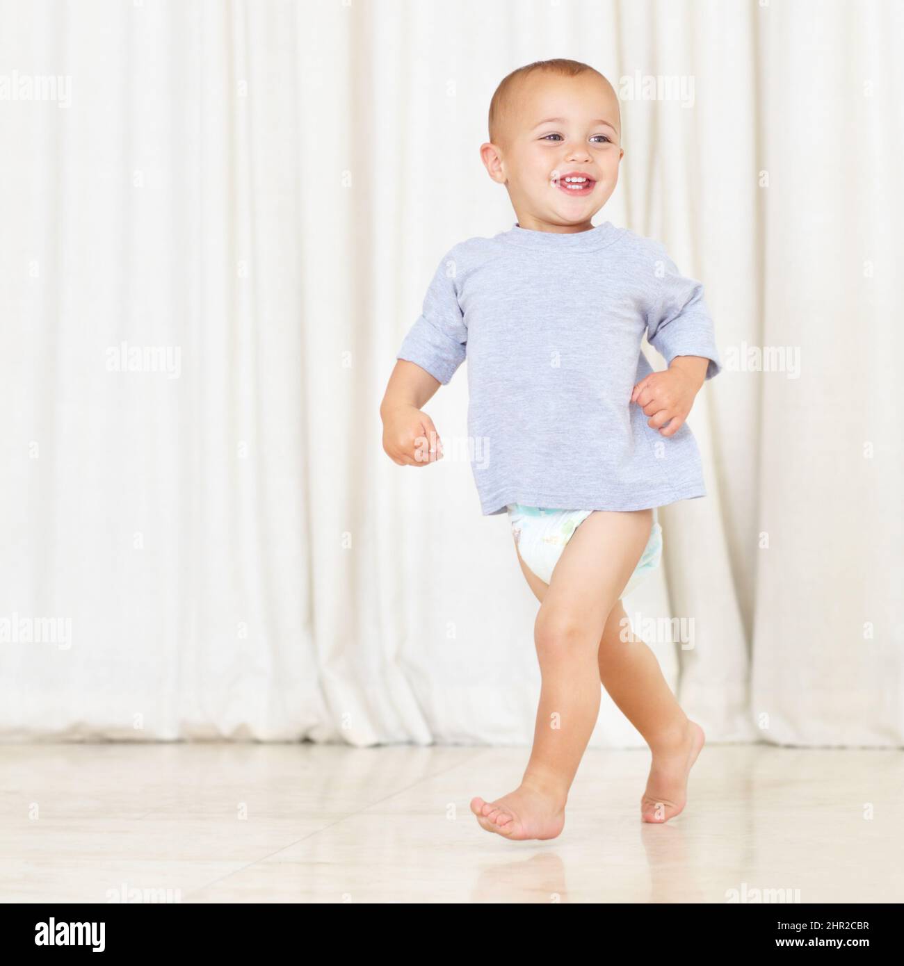 Baby in nappy walking hi-res stock photography and images - Alamy