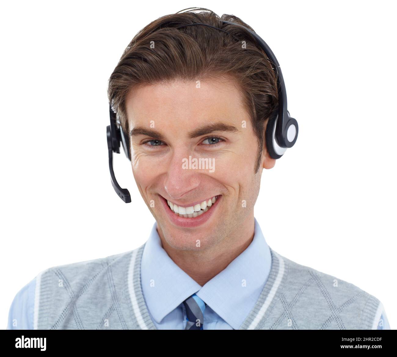Here to help. A young call center agent smiling at you while isolated ...