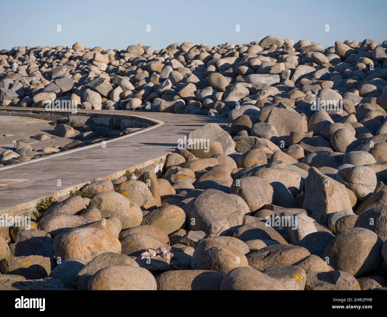 Field of granite boulders with a path going through Stock Photo - Alamy