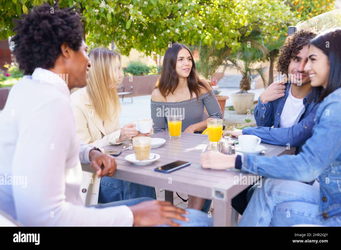 Cheerful group in cafe hi-res stock photography and images - Alamy