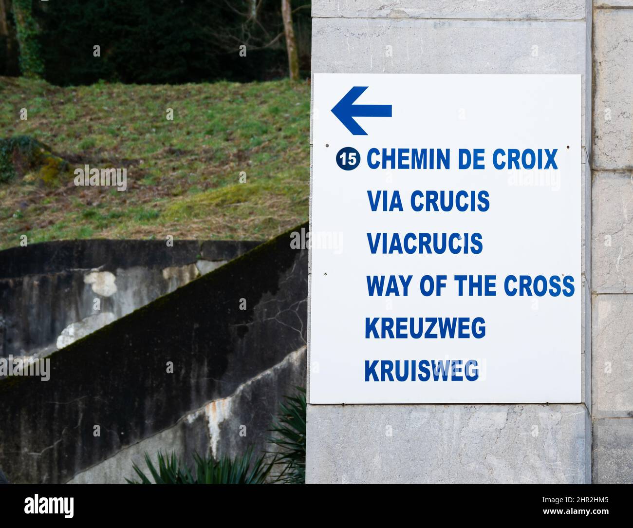 Lourdes, France - February 1, 2022: Sign indicating in different ...