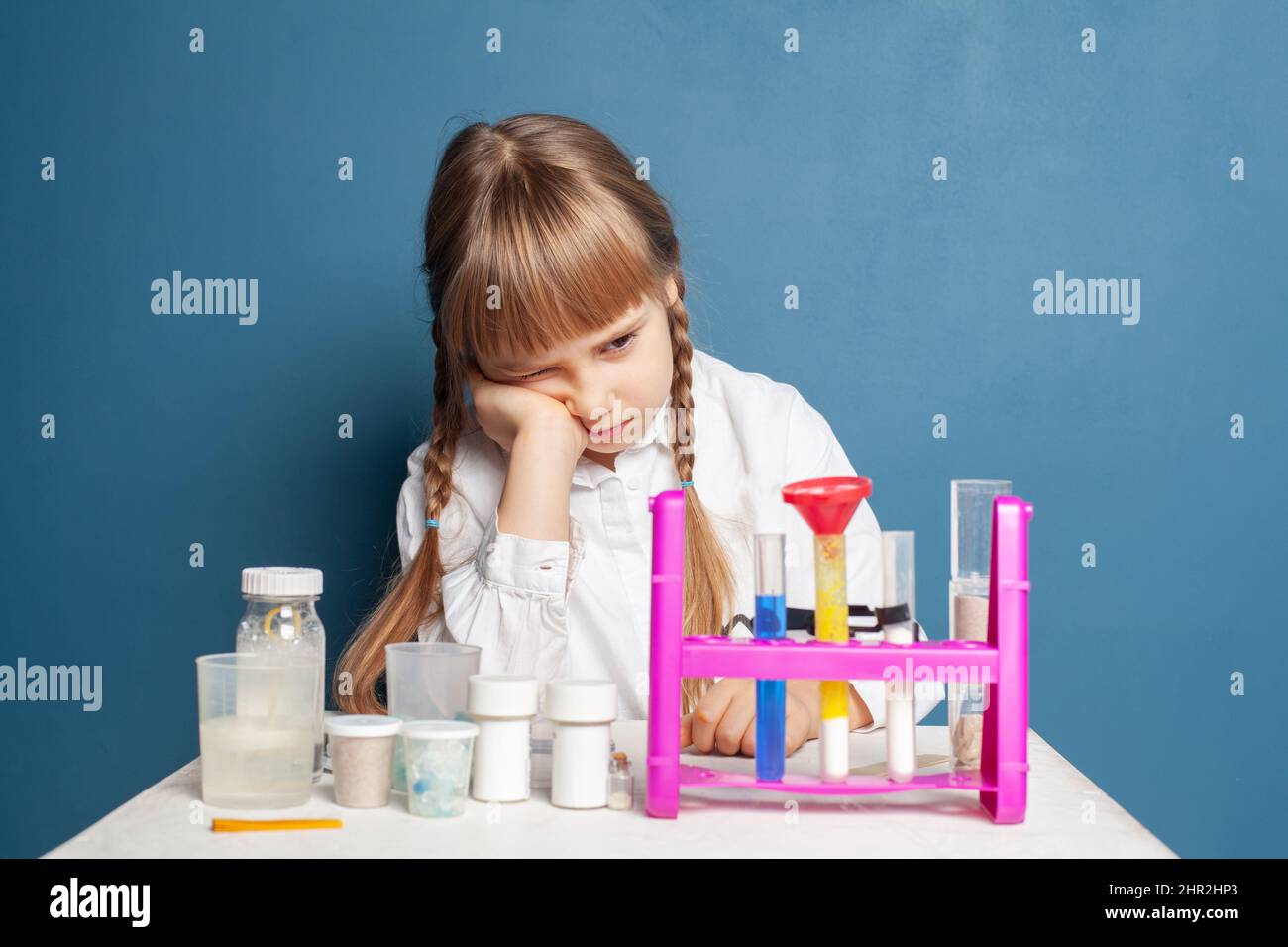Thinking child girl studying science Stock Photo - Alamy