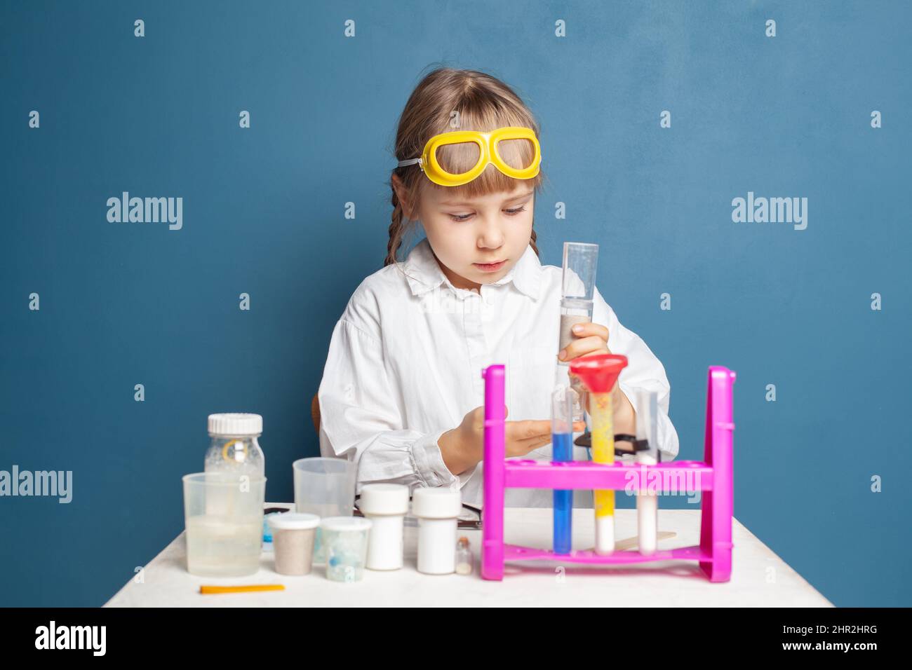 Little child student doing ecology experiment with ecological equipment ...