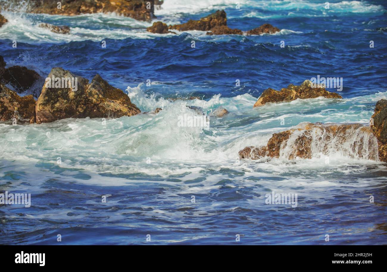 Sea stone beach, sea waves. Colorful blue sea background. The concept ...