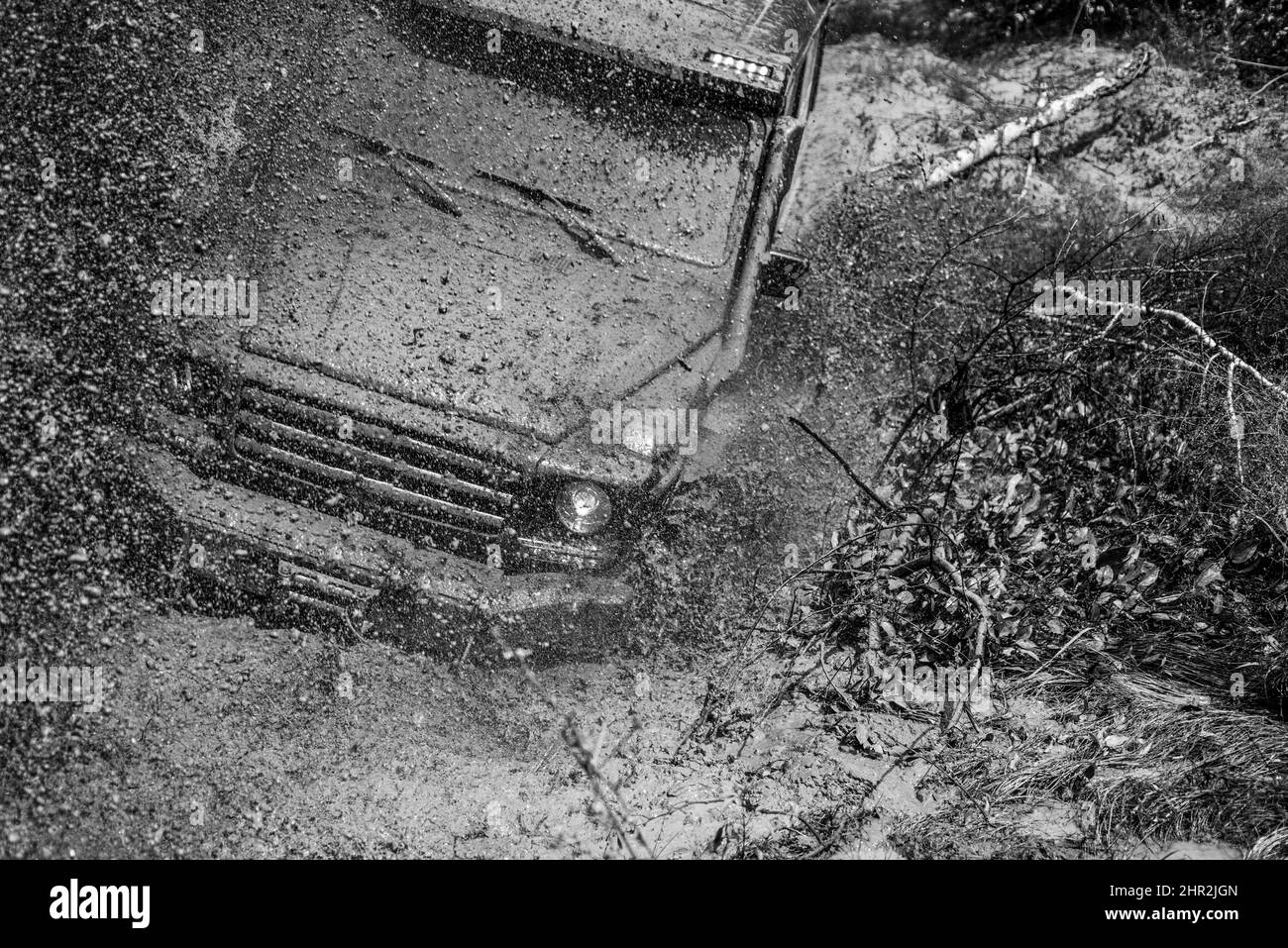 Off-road travel on mountain road. Drag racing car burns rubber. Extreme ...