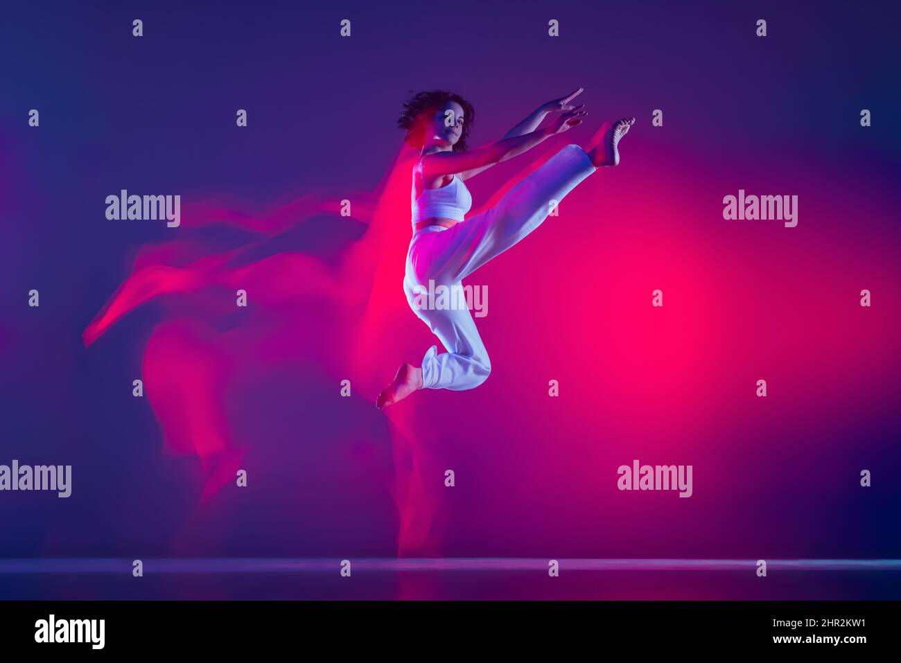 Young sportive beautiful girl, hip-hop dancer dancing hip hop isolated ...